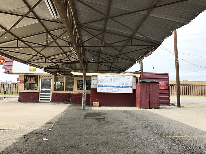 Under this humble canopy, culinary magic happens daily. The metal roof has sheltered decades of hungry Texans from both sun and rain.