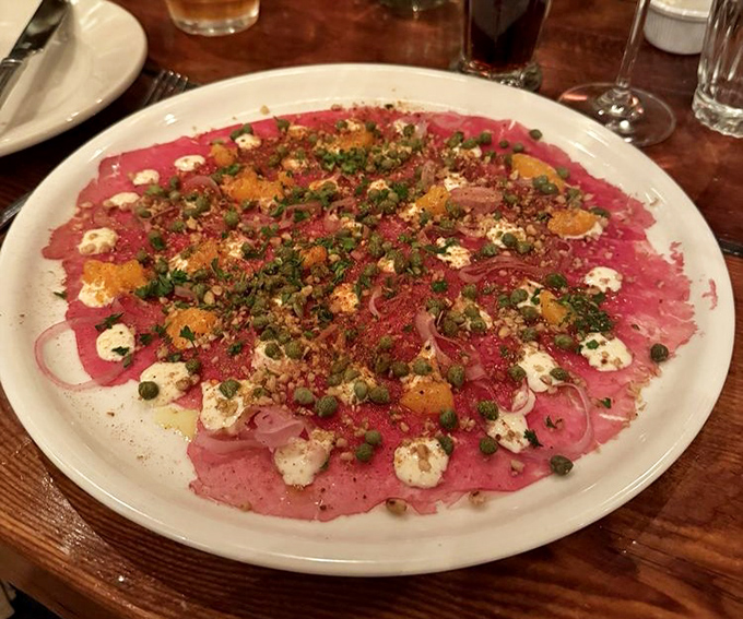 Carpaccio that's dressed to impress. Paper-thin beef adorned with capers, cheese, and citrus &ndash; a symphony of flavors in every bite.