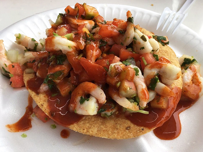 Ceviche tostada: where lime-kissed seafood dances with fresh cilantro on a crispy stage. Standing ovation guaranteed.