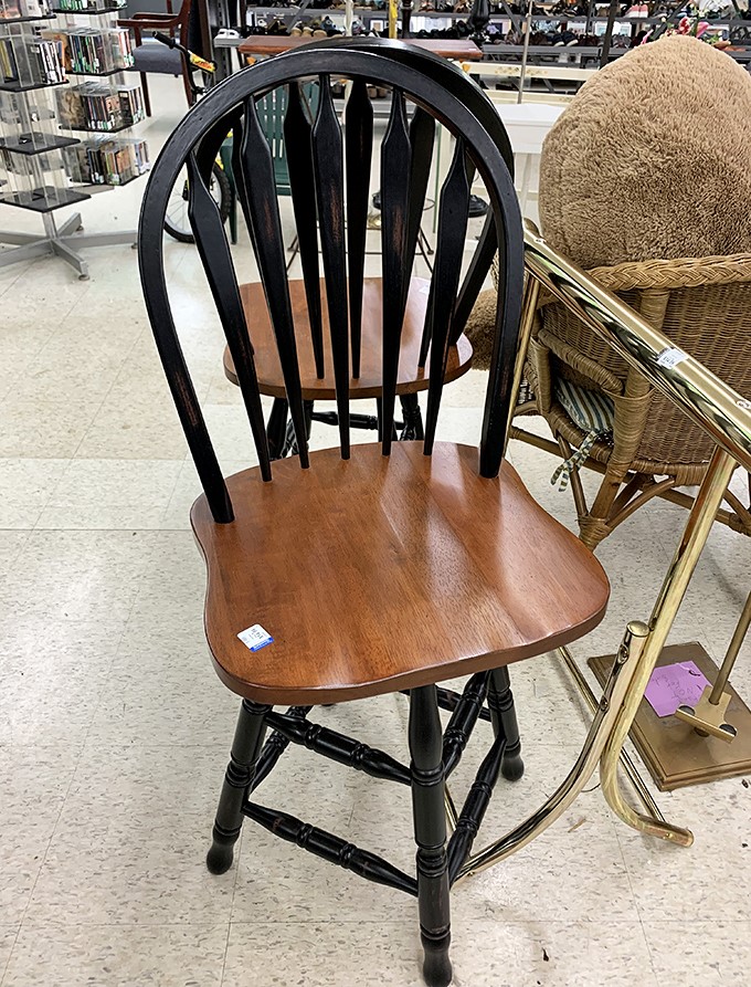 This Windsor-style chair has seen family dinners and homework sessions in its previous life, now waiting patiently for its next chapter to begin.