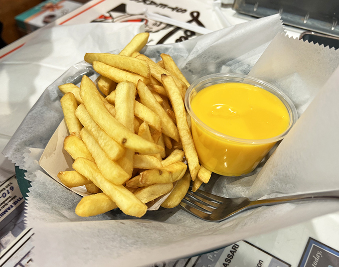 Golden fries with liquid sunshine. This cheese sauce doesn't apologize for being exactly what you want, not what your doctor ordered.