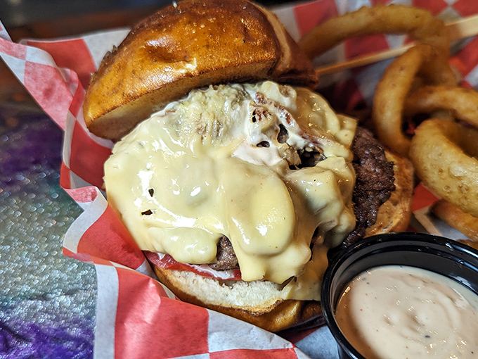 Behold, the perfect burger architecture&mdash;melty cheese cascading down a thick patty, nestled in a toasted bun. Resistance is futile.