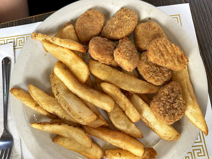 Golden-fried nuggets and fries that remind you why sometimes the simplest pleasures are the most satisfying. No foodie pretension, just honest goodness.