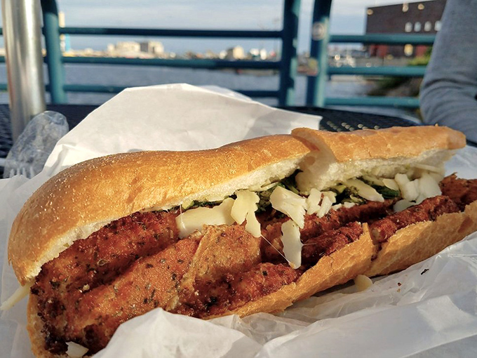 The chicken cutlet sandwich&mdash;where breaded perfection meets Italian inspiration. A handheld masterpiece that makes fork users question their life choices.
