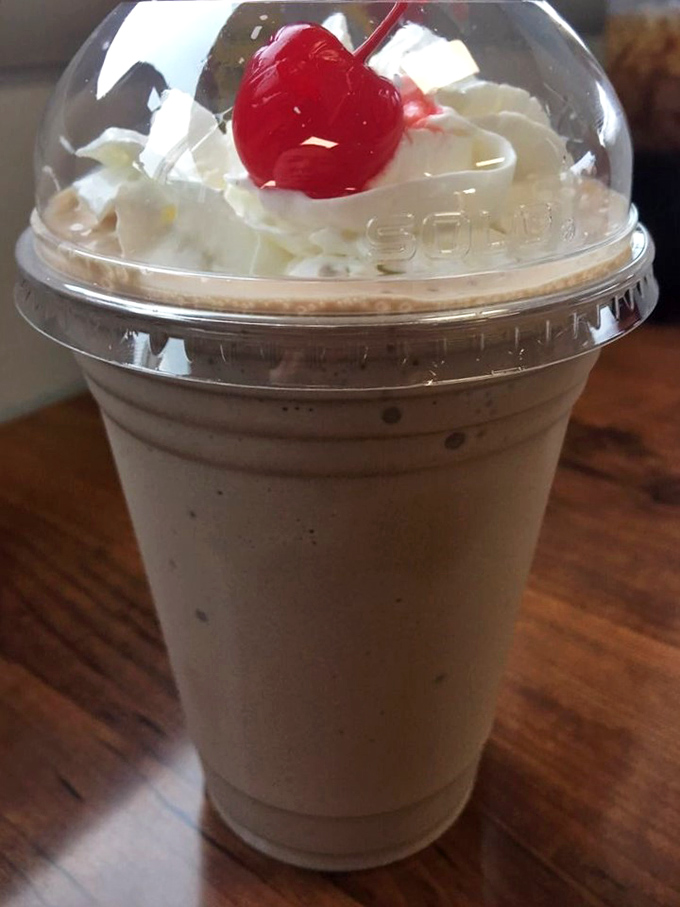 Milkshake topped with whipped cream and a cherry &ndash; thick enough to require serious straw strength and patience worth practicing.