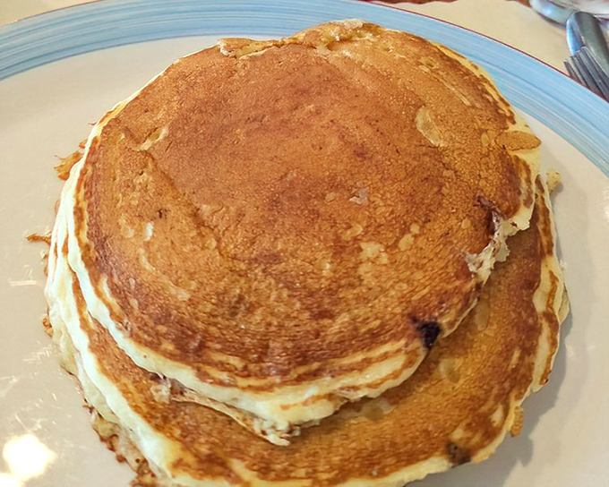 Pancakes stacked like golden discs of happiness&mdash;the kind that make you wonder why anyone would ever skip breakfast.