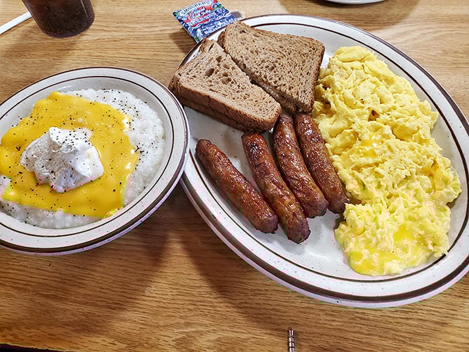 The breakfast trinity – fluffy scrambled eggs, perfectly browned sausage links, and toast that's exactly as toasted as you'd want it.