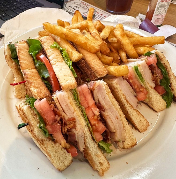 The club sandwich: architectural marvel of the diner world. Stacked higher than some Delaware buildings and requiring jaw exercises before attempting.