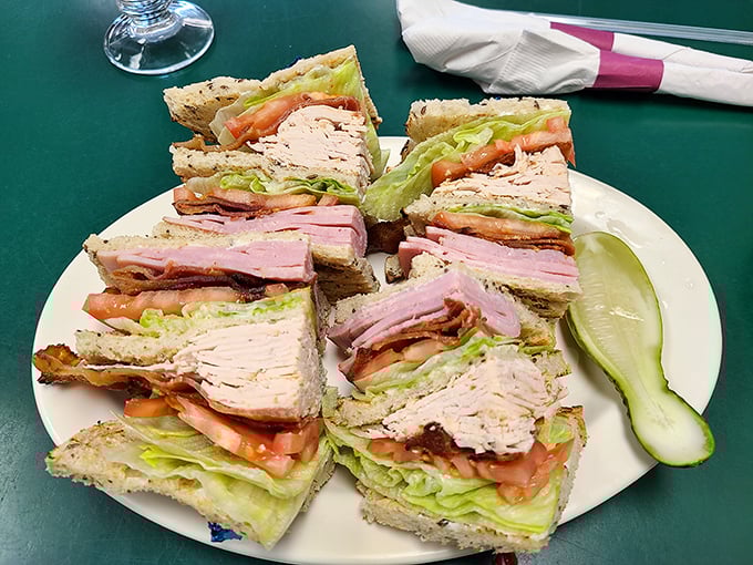 This club sandwich isn't playing around&mdash;layers of turkey, ham, and bacon create a skyscraper of satisfaction that requires serious jaw strategy.