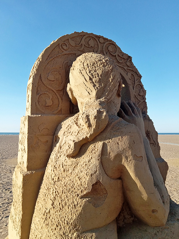 This intricate sand sculpture showcases the temporary art gallery that forms on Headlands Beach when creative visitors come armed with buckets.