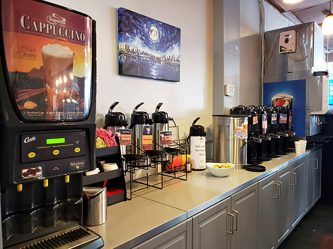 The coffee station&mdash;where morning transformations happen and grumpy caterpillars become functional human butterflies one cup at a time.