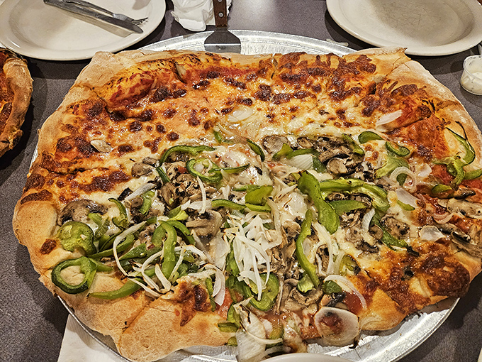 Half plain, half adventurous&mdash;the perfect compromise pizza. Those green peppers and onions provide the perfect counterpoint to all that cheese.