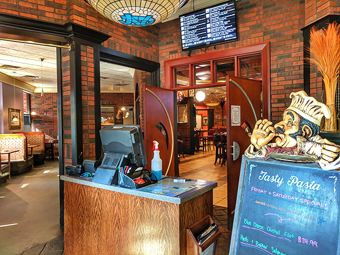 The host station stands ready for the dinner rush, with the chef figurine silently promising delicious things to those patient enough to wait.