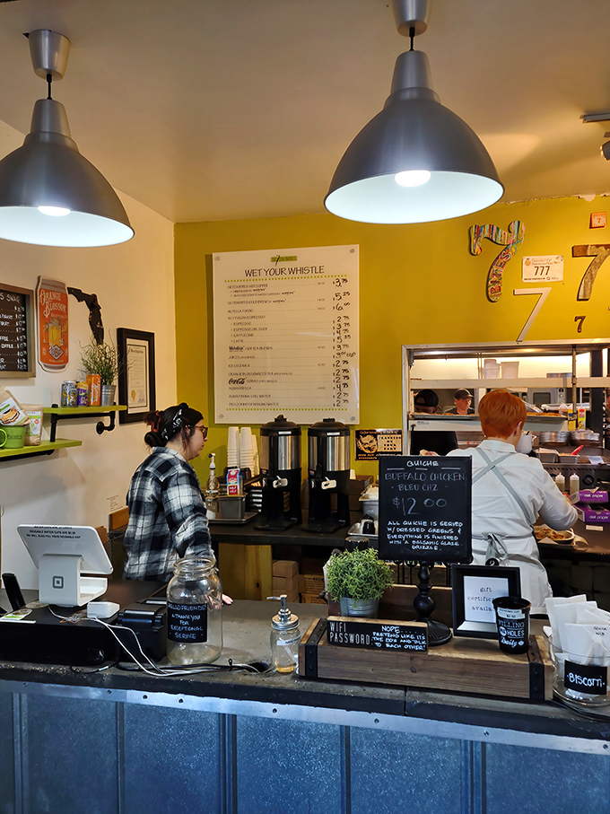 Coffee station or happiness dispensary? The "Wet Your Whistle" menu promises liquid comfort while staff prepare plates of Southern-inspired delights.