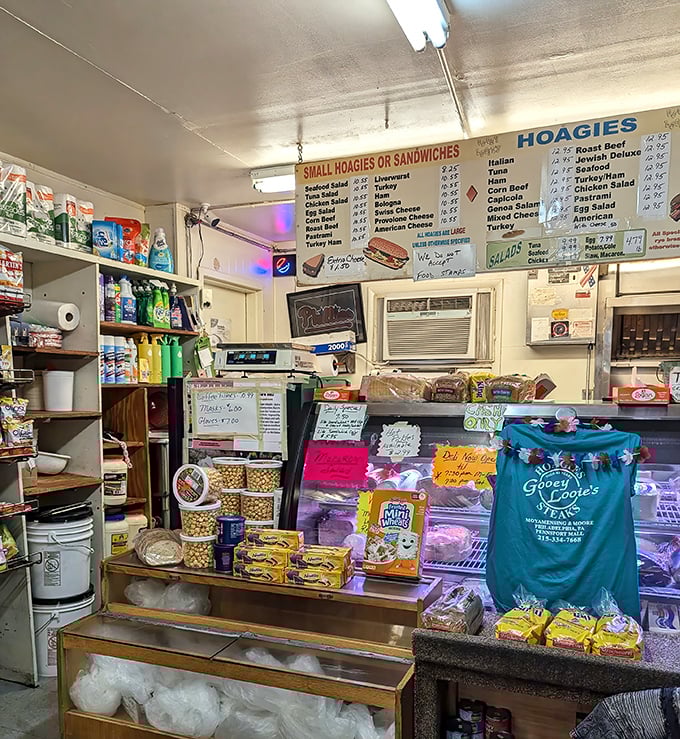 The counter area reveals the beautiful chaos of a beloved neighborhood institution. That blue t-shirt might be the closest thing to formal branding.