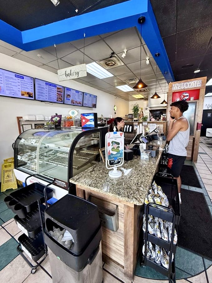 Behind this counter, sandwich magic happens daily. The display case tempts you with possibilities while you contemplate your Cuban cuisine adventure.