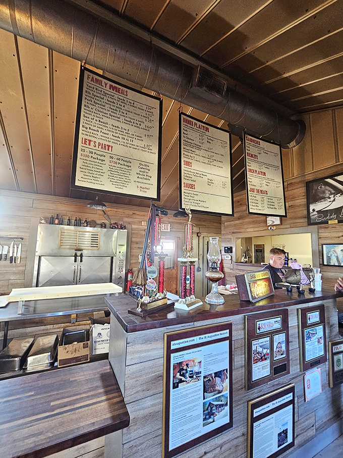 The order counter&mdash;where dreams are placed and fulfilled. Those trophies aren't just decoration; they're promises of what's to come.