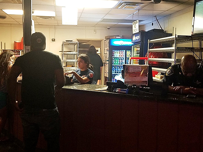 Where pizza dreams begin their journey from order to reality&mdash;the counter where hungry hope transforms into delicious certainty.