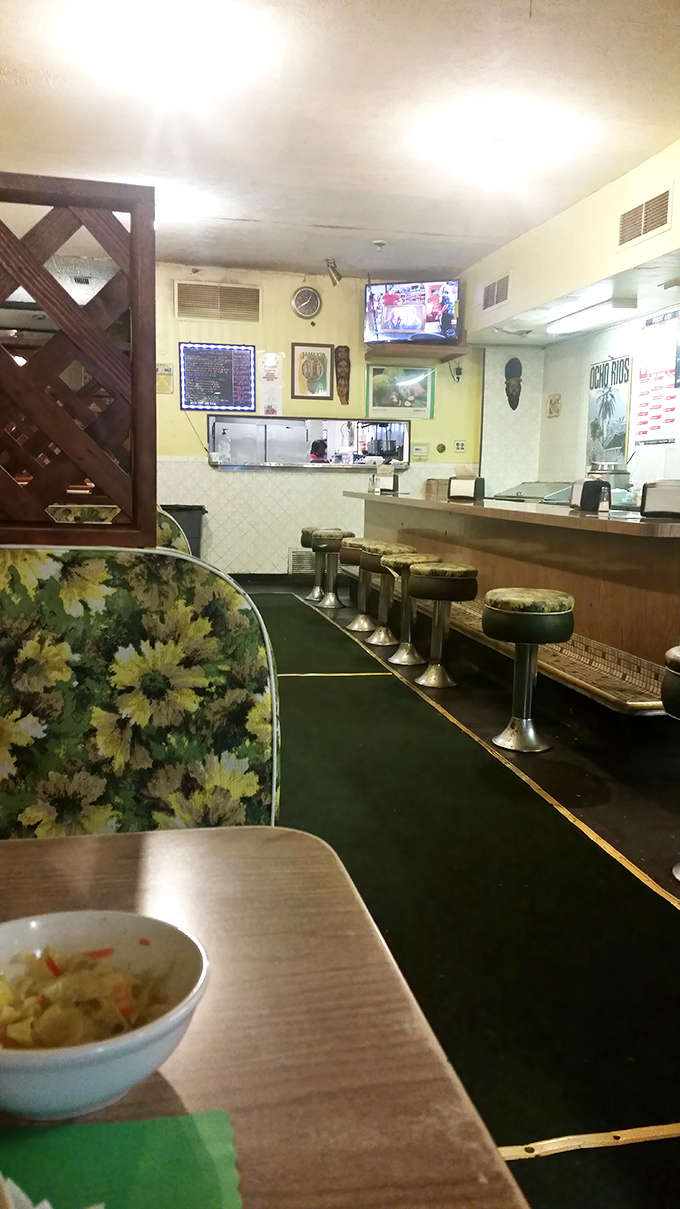 Bar stools lined up like eager audience members, ready for the show-stopping flavors that have made this modest spot a Pittsburgh legend.