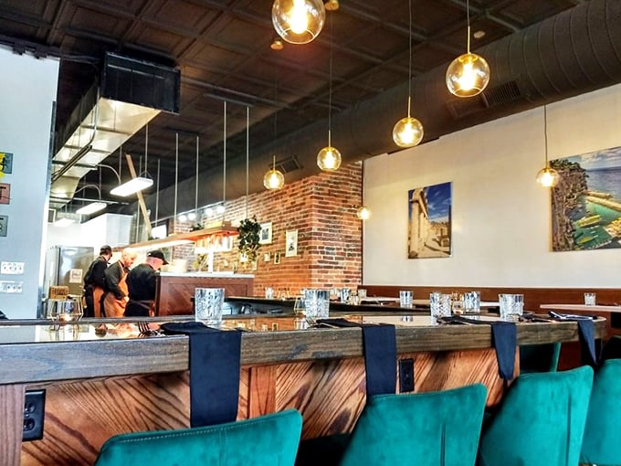 The bar area isn't just for waiting—it's prime real estate for watching pasta artisans at work while sipping something Italian and wonderful.