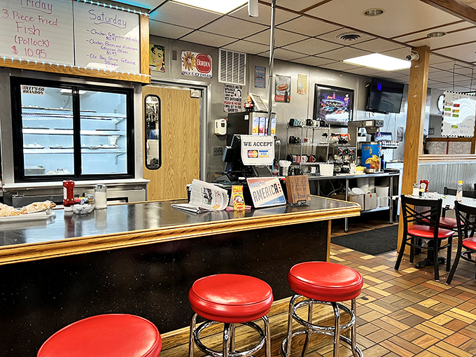 Classic counter seating where solo diners find community and the red stools have heard every story Bedford has to offer.