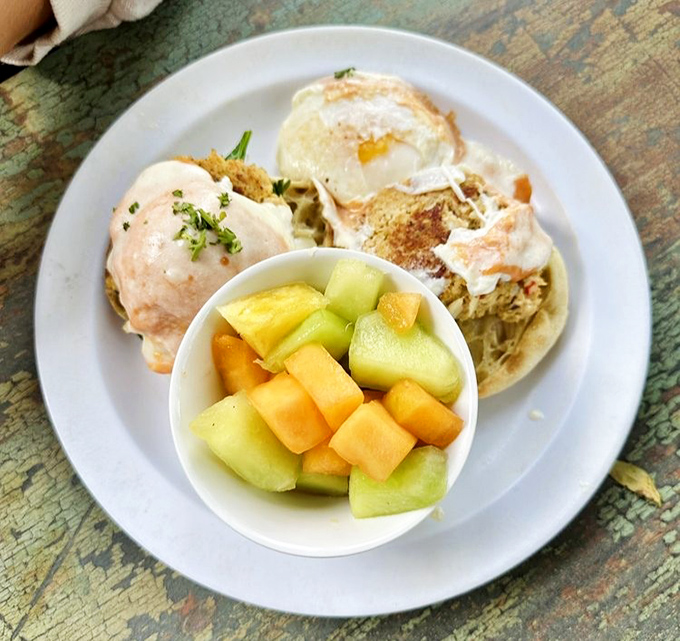 Crab cake benedict that makes you question why you'd ever order anything else, with fruit on the side to pretend you're being virtuous.
