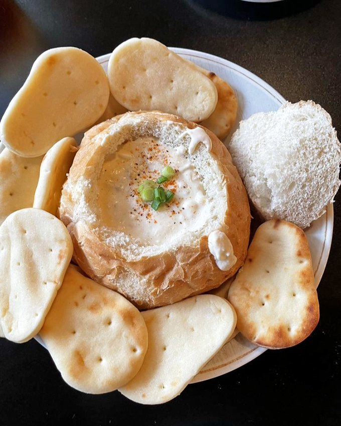 Bread bowl brilliance! Creamy dip surrounded by crisp crackers creates the perfect shareable starter that no one actually wants to share.