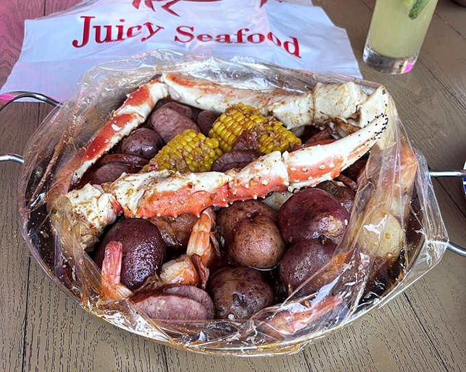 The plastic bag presentation isn't fancy, but what's inside is pure seafood royalty. Crab legs, potatoes, corn&mdash;a complete ecosystem of flavor.