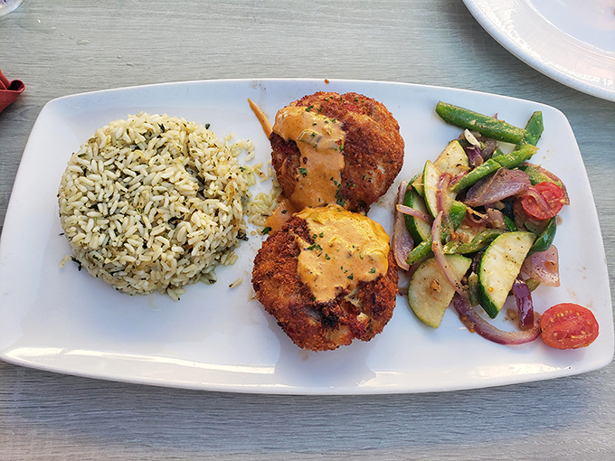 These crab cakes aren't just generous&mdash;they're philanthropic. The rice and vegetables provide the illusion that you're making healthy choices. 