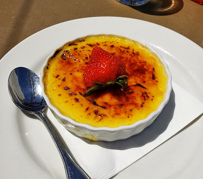 Cr&egrave;me br&ucirc;l&eacute;e with a crackling top that makes a more satisfying sound than bubble wrap. That strawberry isn't decoration&mdash;it's the exclamation point.