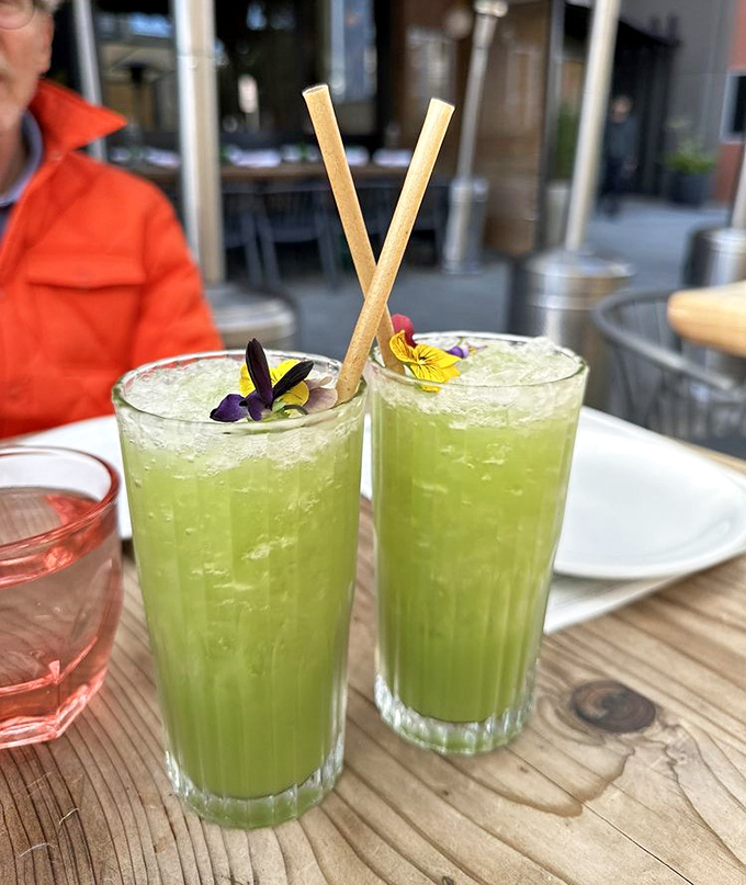 Cucumber agua frescas garnished with edible flowers&mdash;proof that hydration can be both beautiful and delicious. Like drinking a spa day, but tastier.