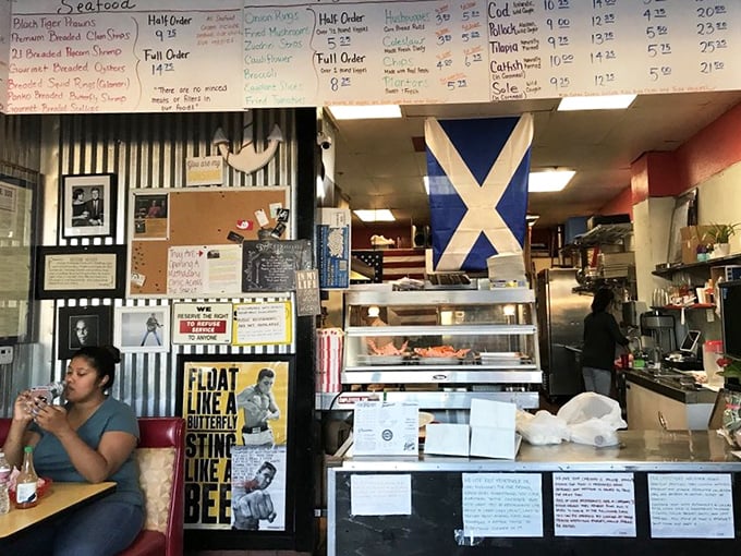 Where tradition meets the fryer. The Scottish flag proudly watches over the counter as customers eagerly await their crispy treasures.