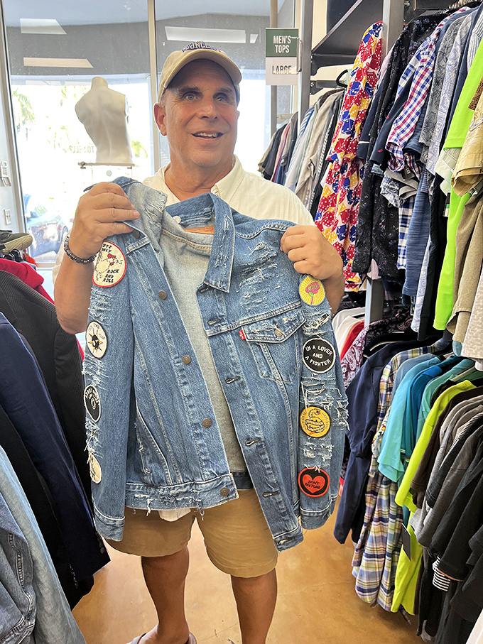 The universal "I just found something amazing" smile transcends language barriers in the universal hunt for the perfect vintage denim jacket.