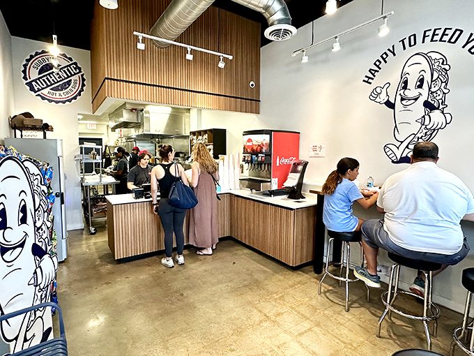 The universal language of sandwich anticipation. That counter is where dreams come true, one order at a time.