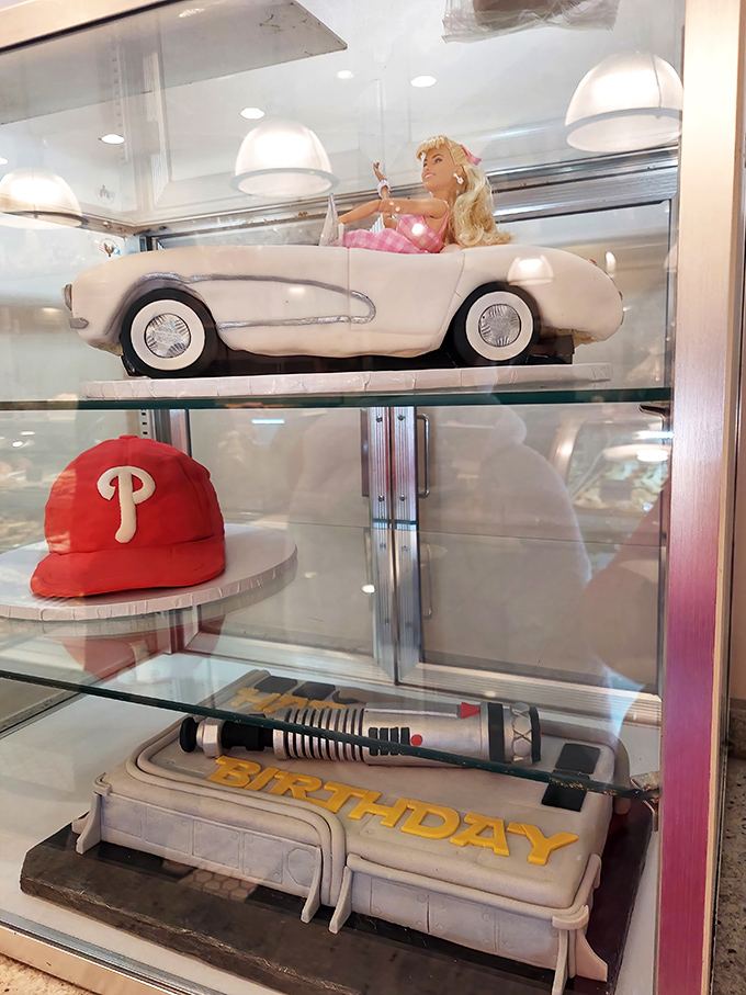 Specialty cakes including a Barbie in a convertible and Phillies memorabilia - where childhood dreams and adult celebrations meet.