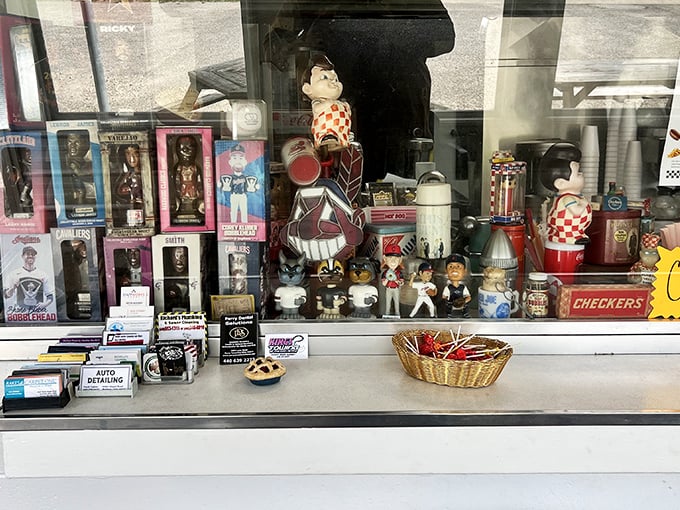 The counter display case is a time capsule of Americana. Each figurine and collectible has witnessed thousands of "best burger ever" declarations. 