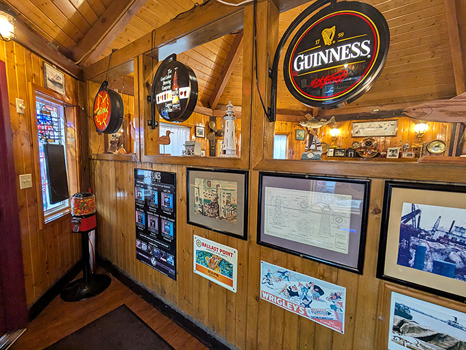 The walls serve as a maritime museum where Guinness signs and nautical charts create the perfect backdrop for seafood feasting.