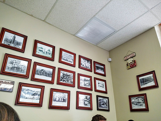 A gallery wall of local history frames your meal with community pride. Each photo tells a story of Pittsburgh's rich heritage.