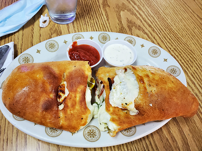 This stromboli isn't messing around&mdash;golden, bubbling perfection with dipping sauces that make you consider licking the plate when no one's looking.