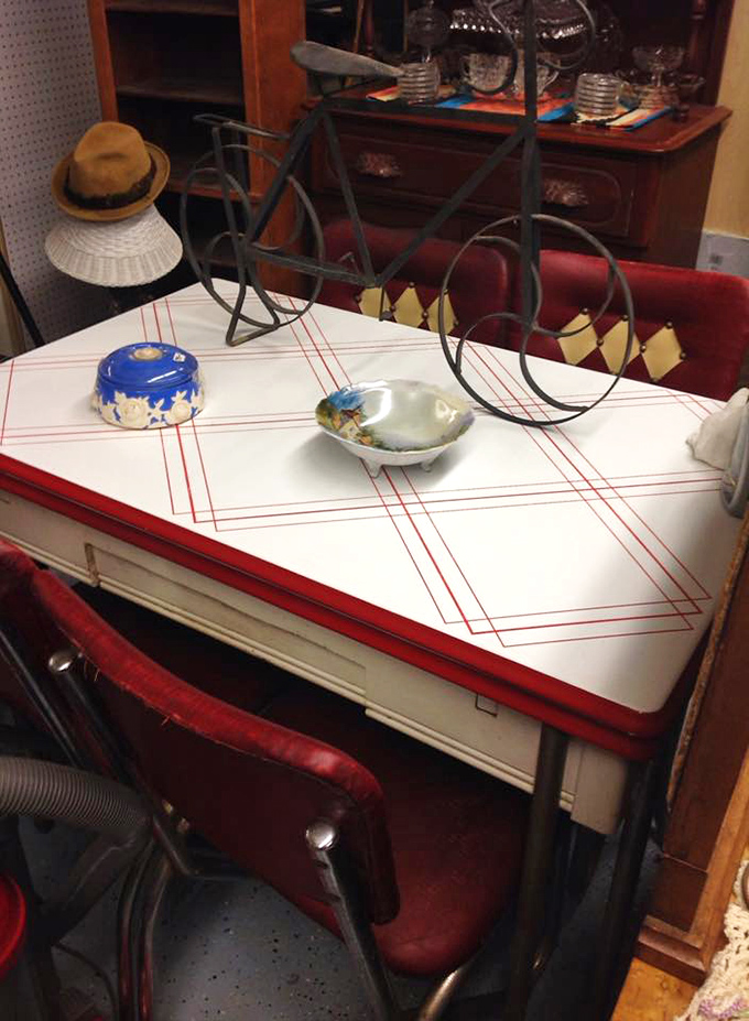 This red-trimmed enamel table isn't just kitchen furniture&mdash;it's where countless family card games and morning coffees created lifetime memories.