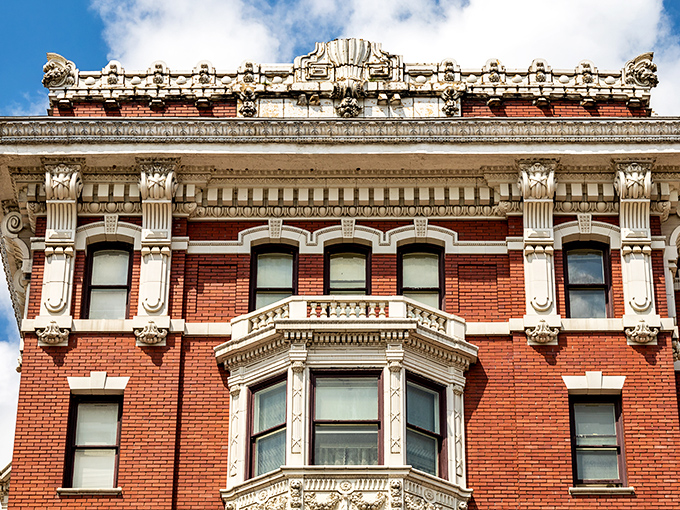 Ornate cornices and decorative details crown this historic building. When architects spoke the language of embellishment, they created streetscapes worth looking up for.