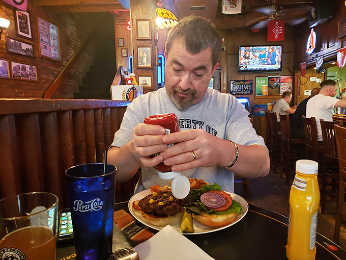 The look of someone about to experience burger nirvana. That focused concentration is the universal language of "don't interrupt me right now."