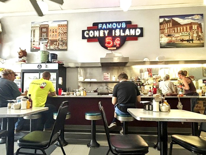 The counter isn't just for solo diners &ndash; it's community seating where strangers become friends over shared coney appreciation.