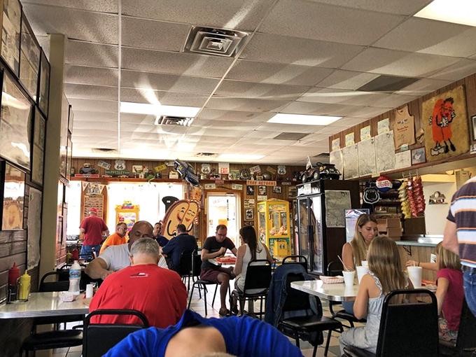 A dining room where strangers become temporary friends, united by the universal language of "mmm" and "pass the ketchup."