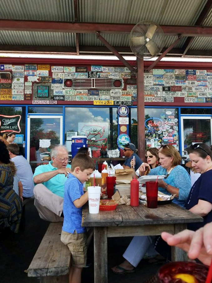 Multi-generational dining under license plates from across America. Good barbecue brings families together better than any reunion ever could.