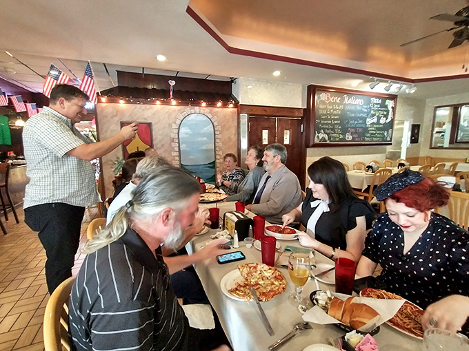 The true measure of a great restaurant: happy diners engaged in that beautiful dance of conversation, laughter, and the occasional reverent silence that follows a perfect bite.