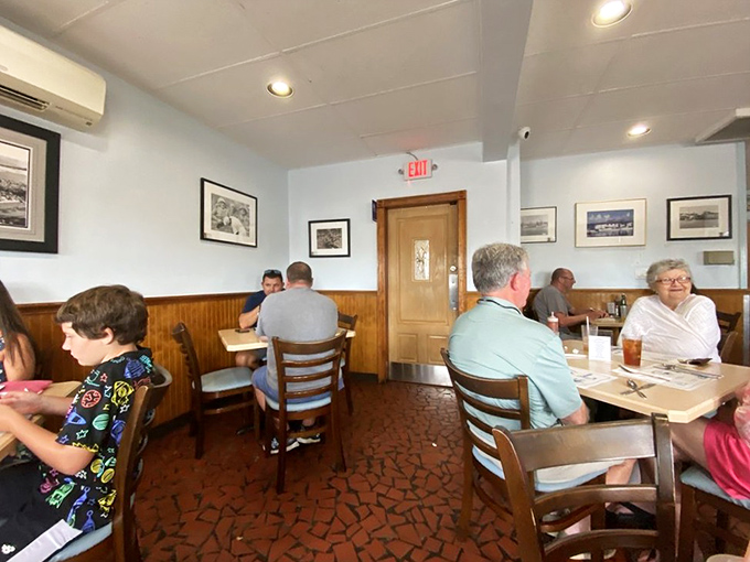 The dining room hums with the satisfied murmurs of regulars and lucky tourists alike. Those distinctive floors have supported generations of seafood seekers.
