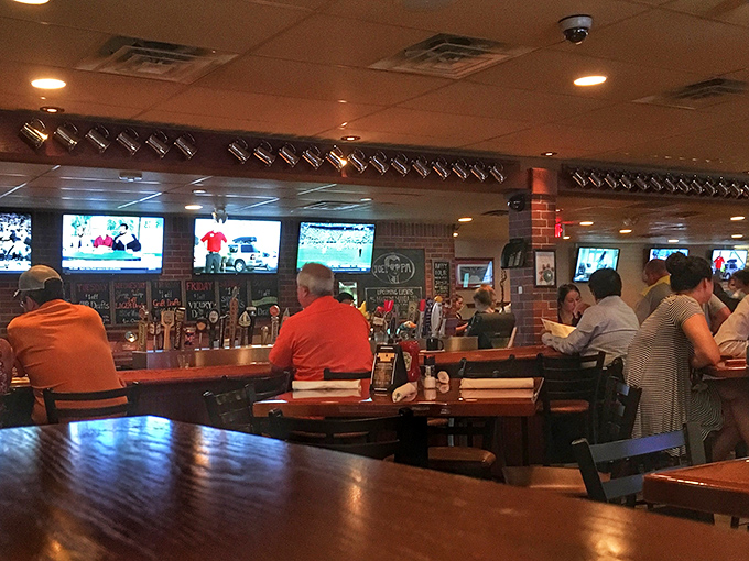 The bar area during game time &ndash; where strangers become friends united by sports, good food, and the shared language of "pass the ketchup."