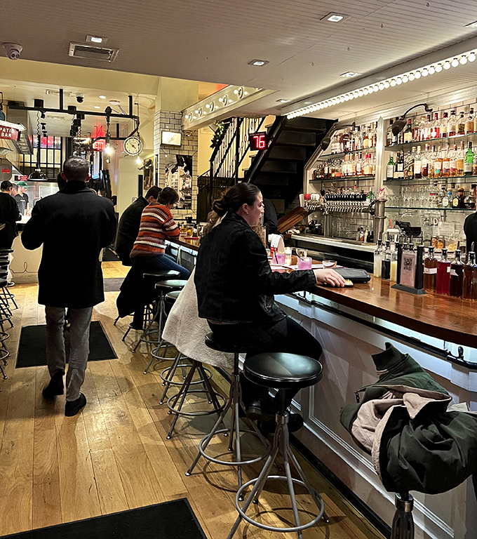 Where decisions are made and friendships are tested. The bar's warm wood invites you to settle in for "just one more."