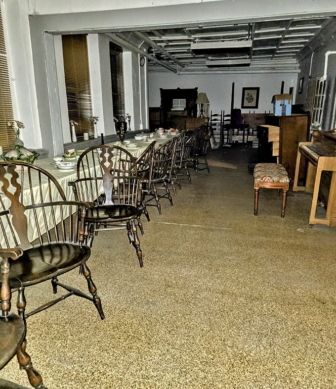 The dining area's Windsor chairs stand in formation, awaiting phantom diners. Meals here were functional affairs, not social gatherings.
